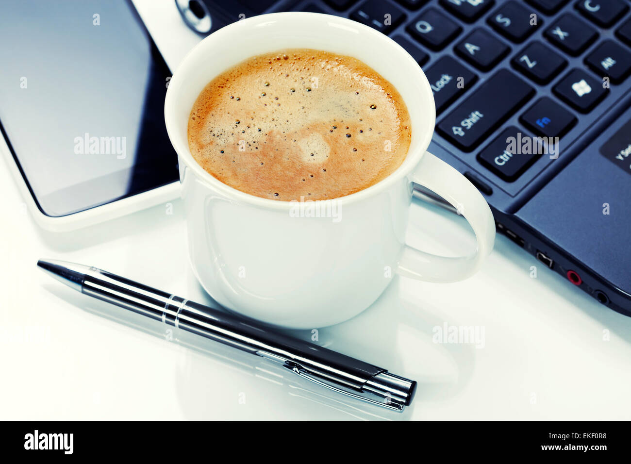 A cup of coffee and laptop Stock Photo - Alamy