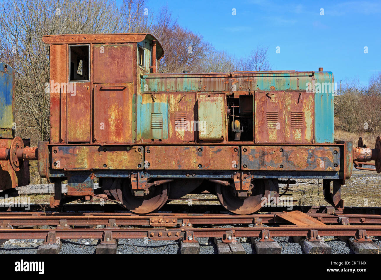 Rusting, disused and abandoned industrial traction train parked on a ...