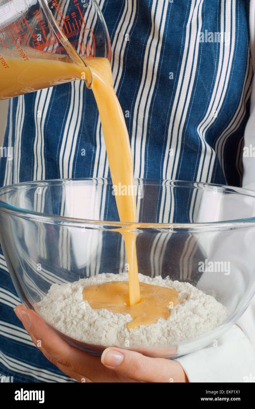 Cooking making pancake mixture Stock Photo - Alamy