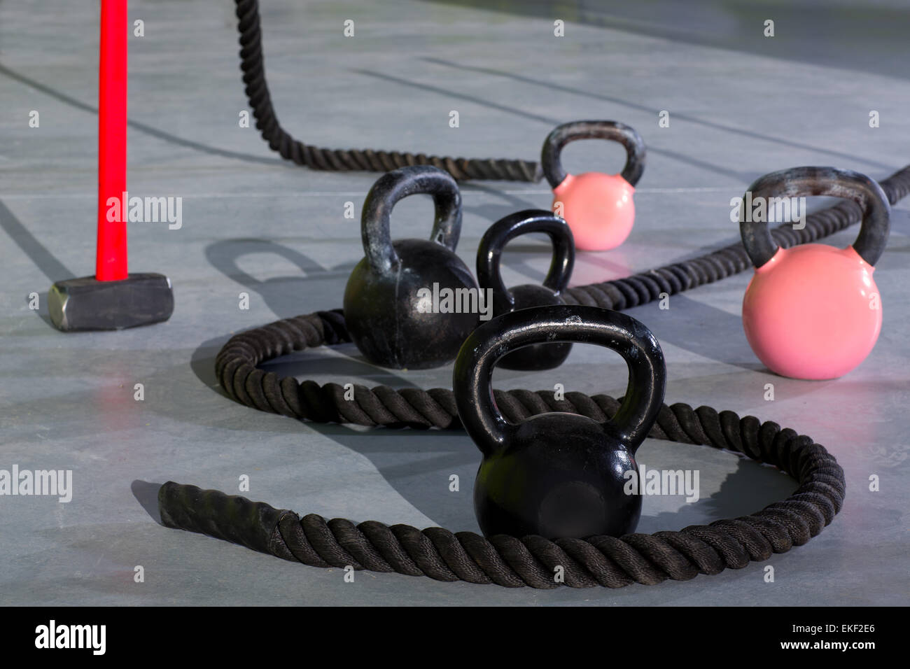 Crossfit Kettlebells ropes and hammer Stock Photo - Alamy