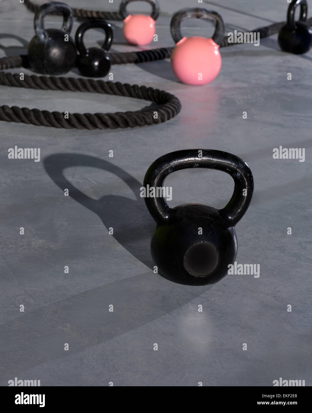 Crossfit Kettlebells ropes in fitness gym Stock Photo - Alamy