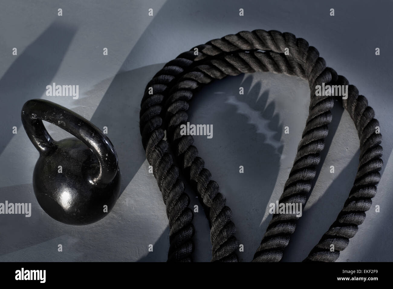 Crossfit Kettlebell and battle rope at gym Stock Photo - Alamy