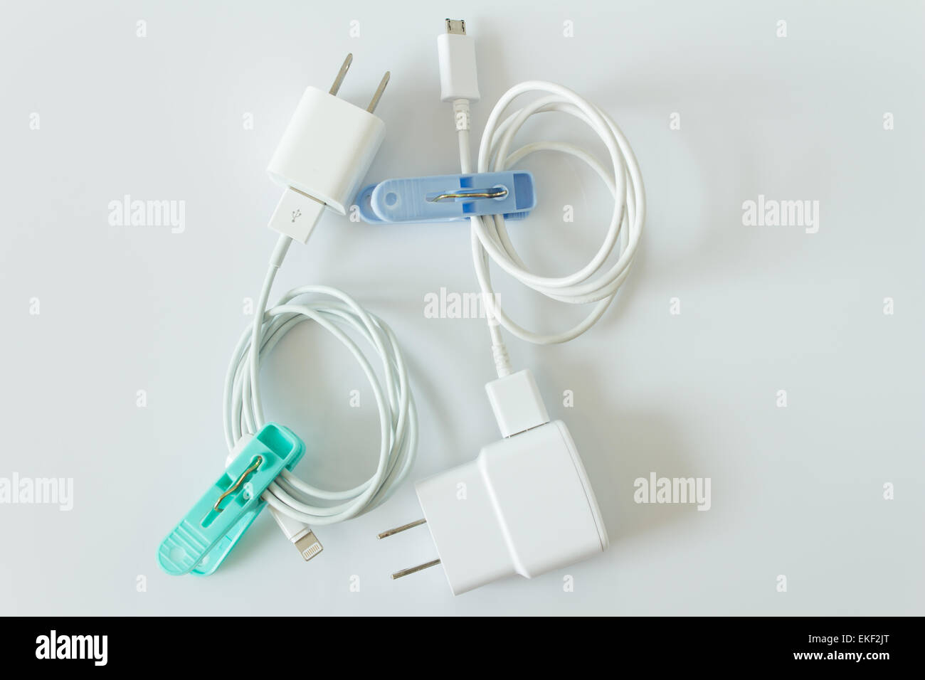 Battery charger and wires tech mess keeping in good Stock Photo - Alamy