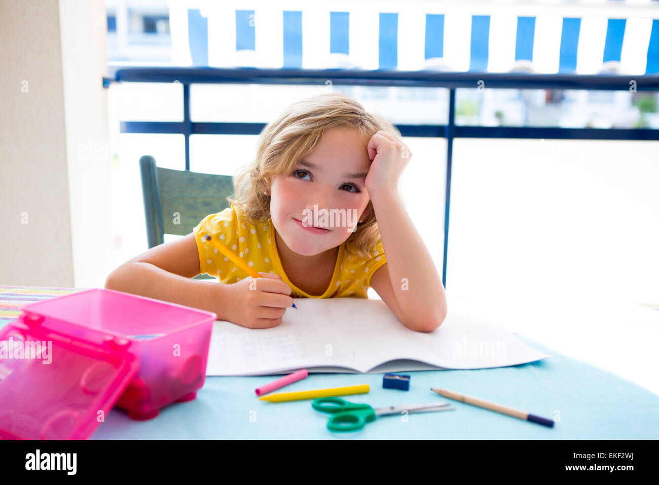 Child student kid girl bored with homework on desk Stock Photo - Alamy