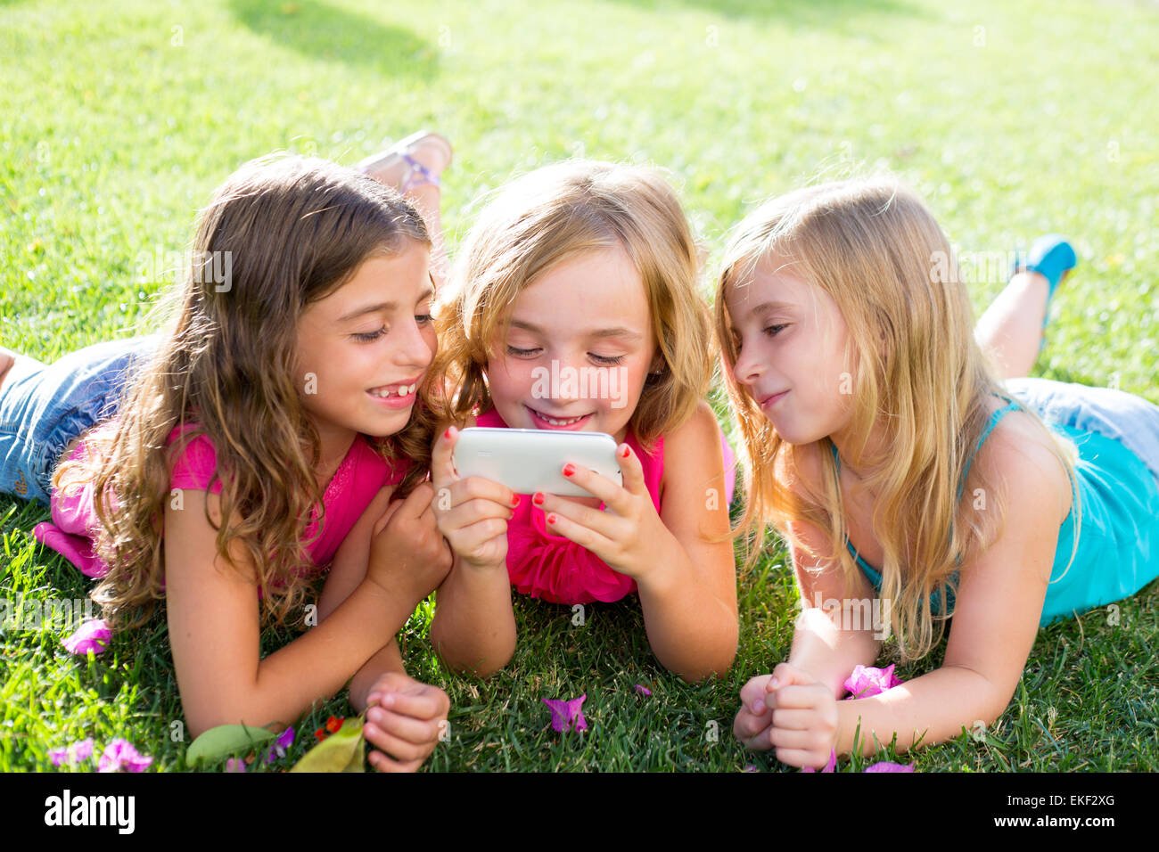 children friend girls playing internet with smartphone Stock Photo - Alamy