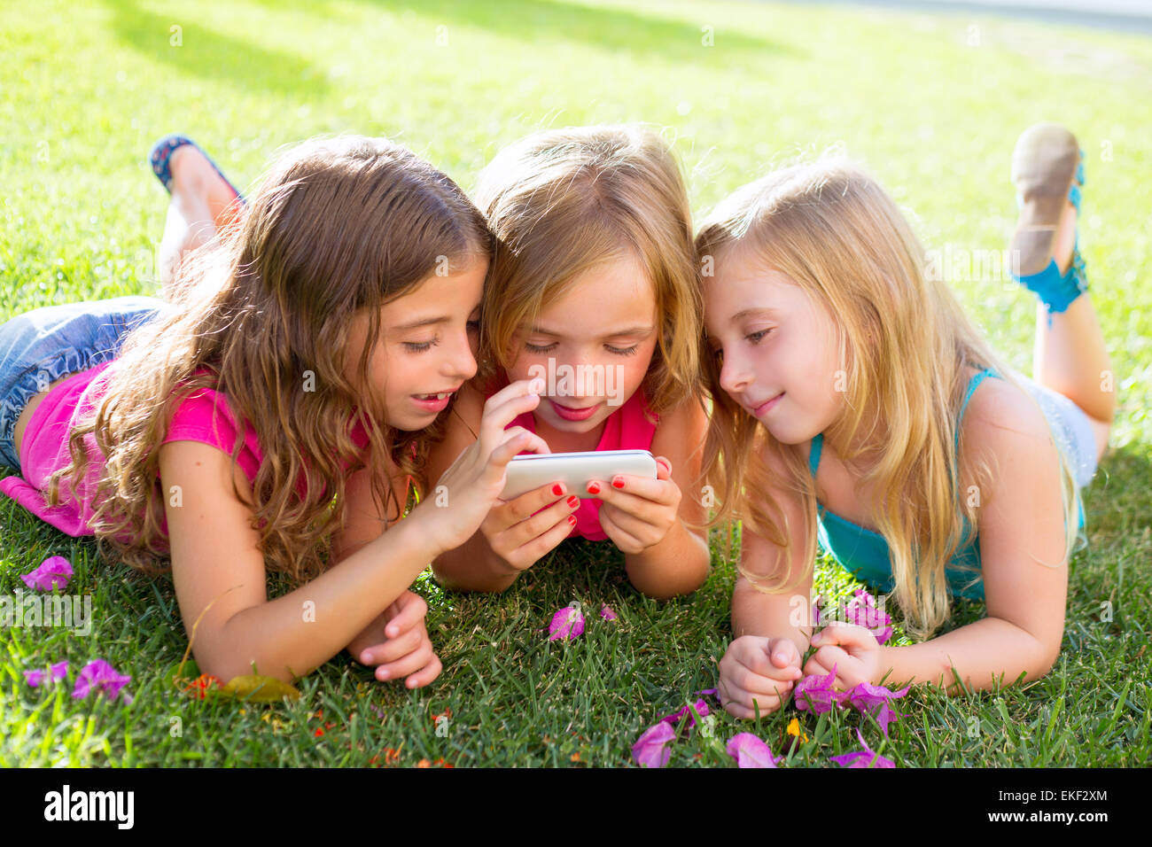 children friend girls playing internet with smartphone Stock Photo - Alamy