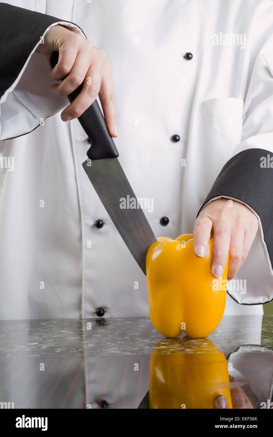 Chef Cutting Yellow Pepper Stock Photo - Alamy