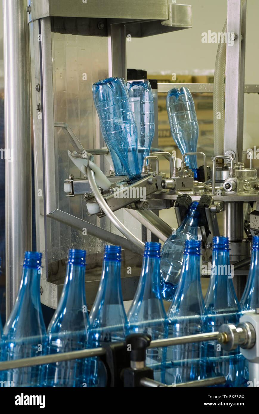 Water bottle production machine Stock Photo - Alamy