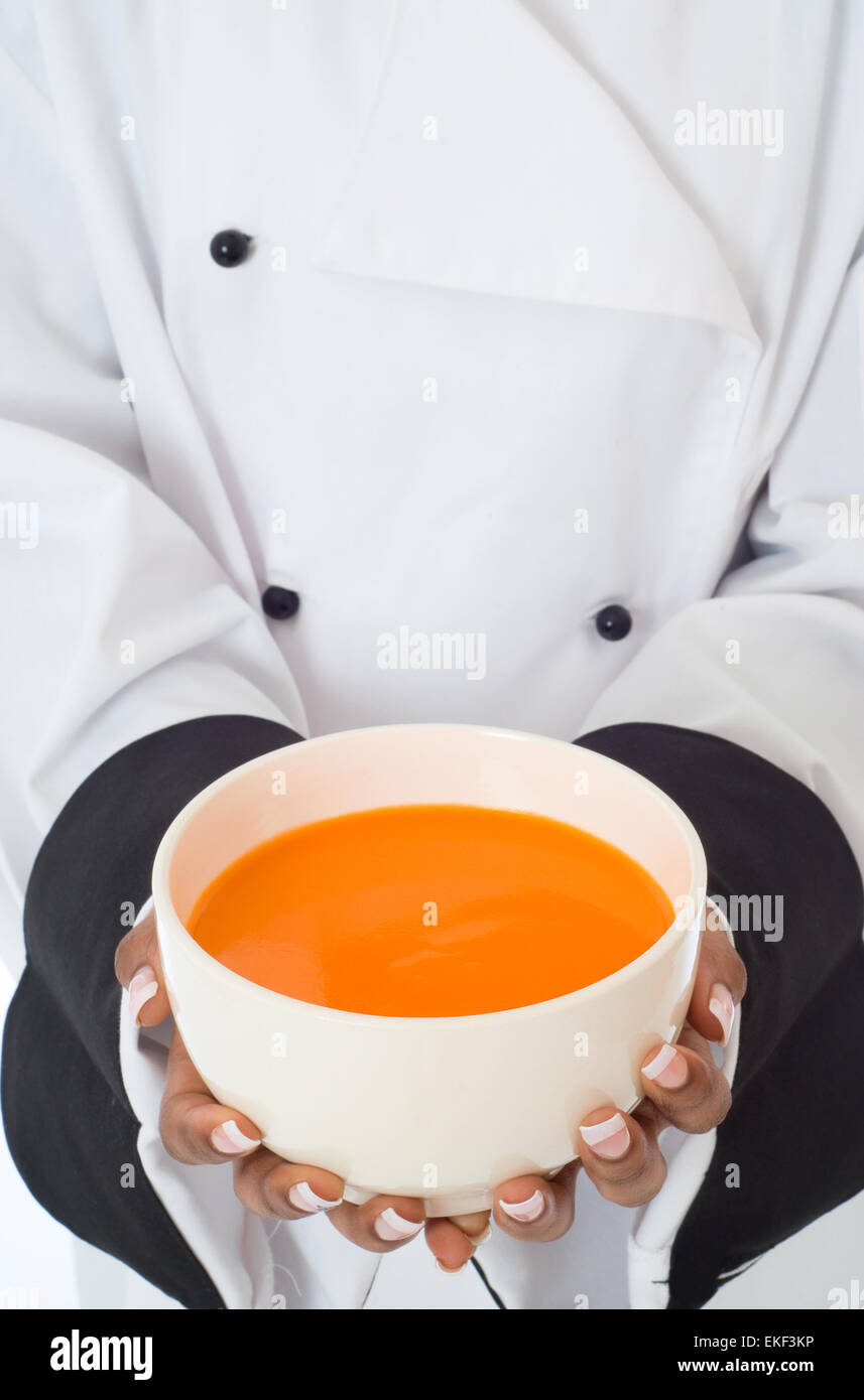 Chef serving soup Stock Photo - Alamy