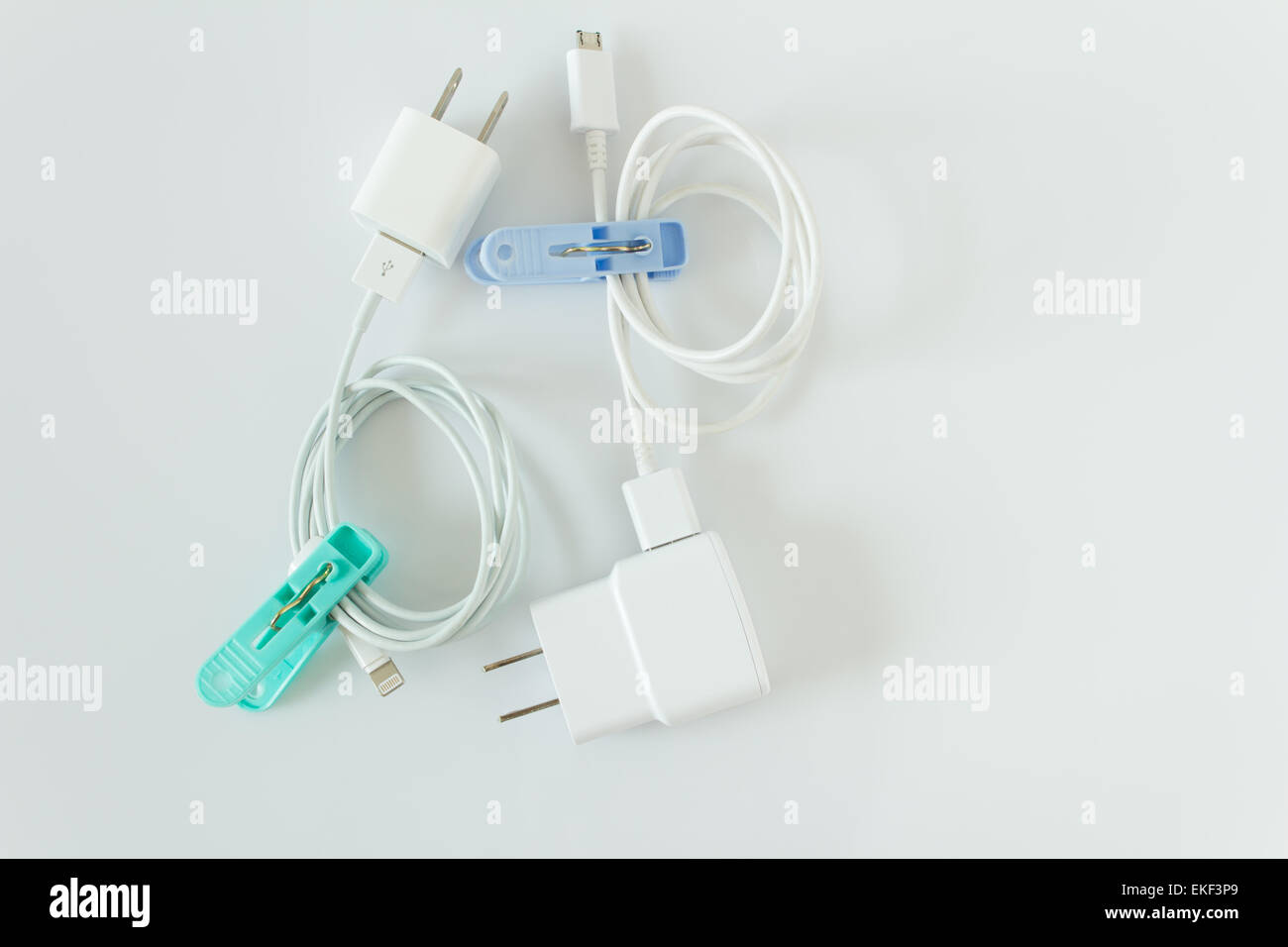 Battery charger and wires tech mess keeping in good Stock Photo - Alamy