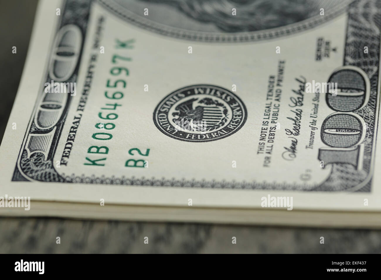 hundred dollar bills on wood table Stock Photo - Alamy
