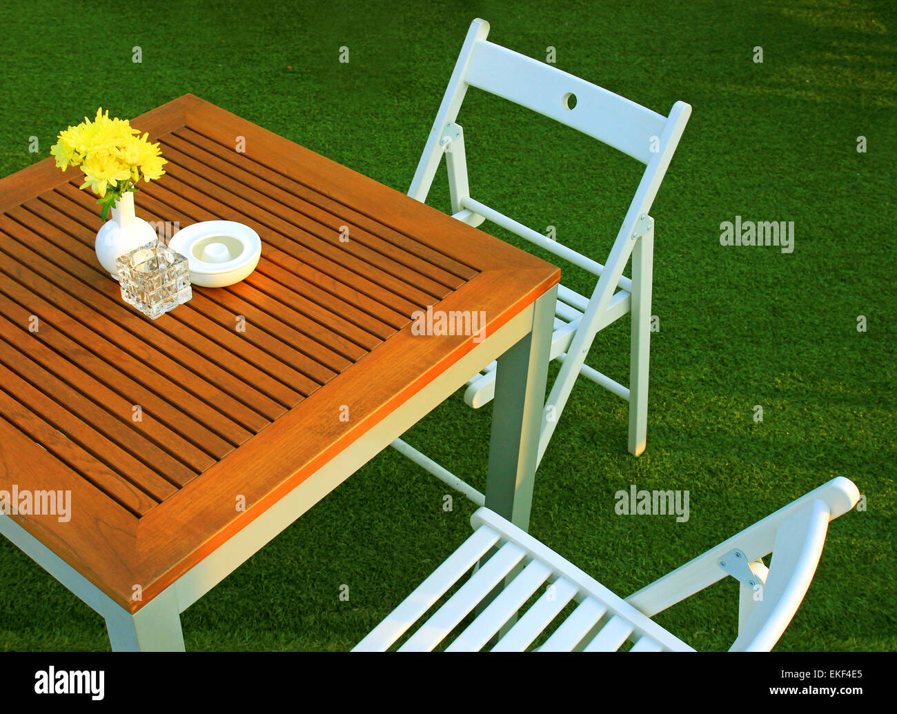 Table and chair setting with flower in outdoor restaurant Stock Photo ...