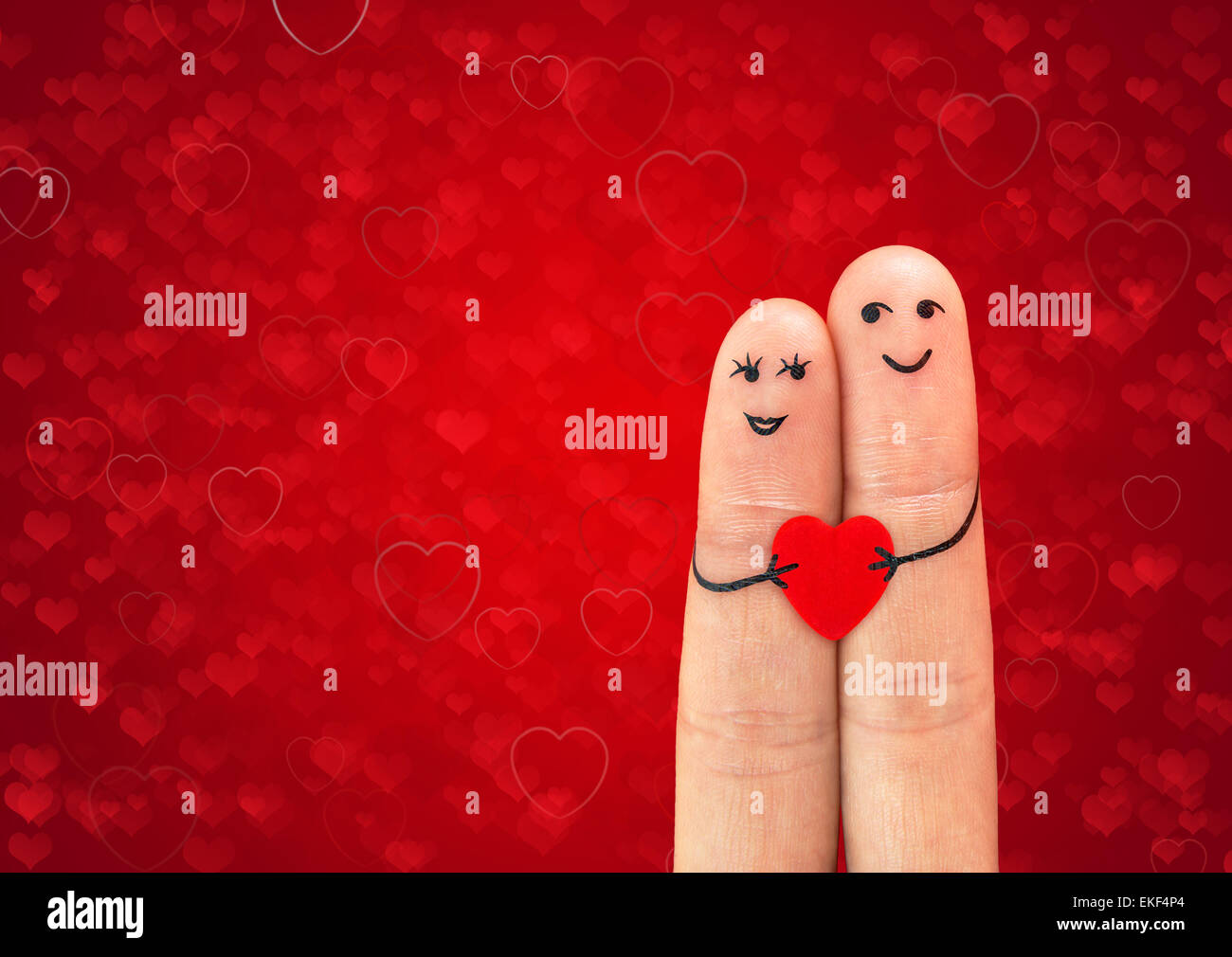 Couple holding love sign hi-res stock photography and images - Alamy
