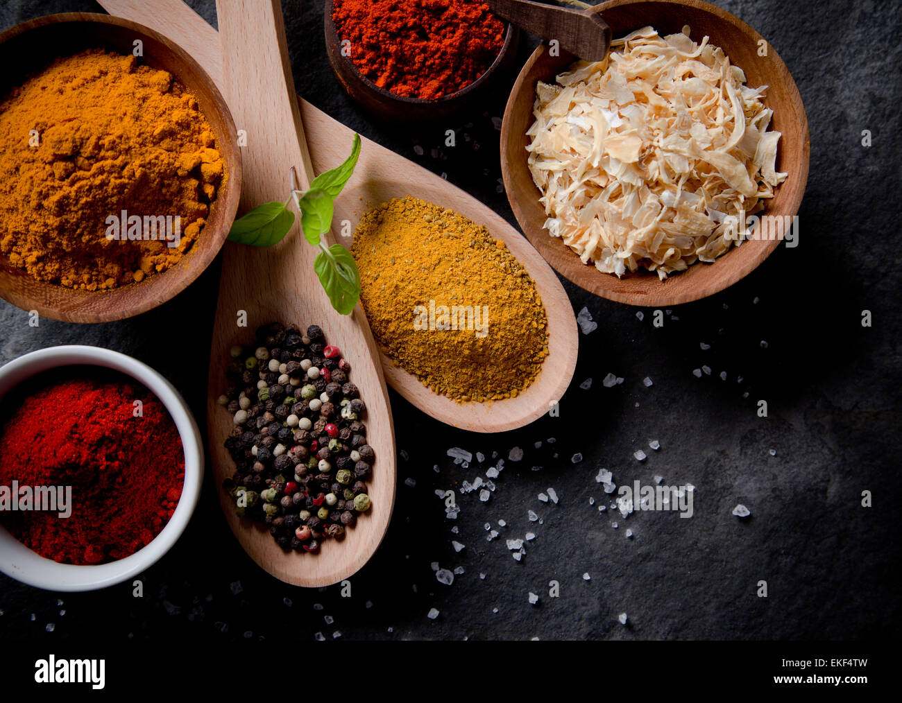 Assorted spices on stone background Stock Photo - Alamy