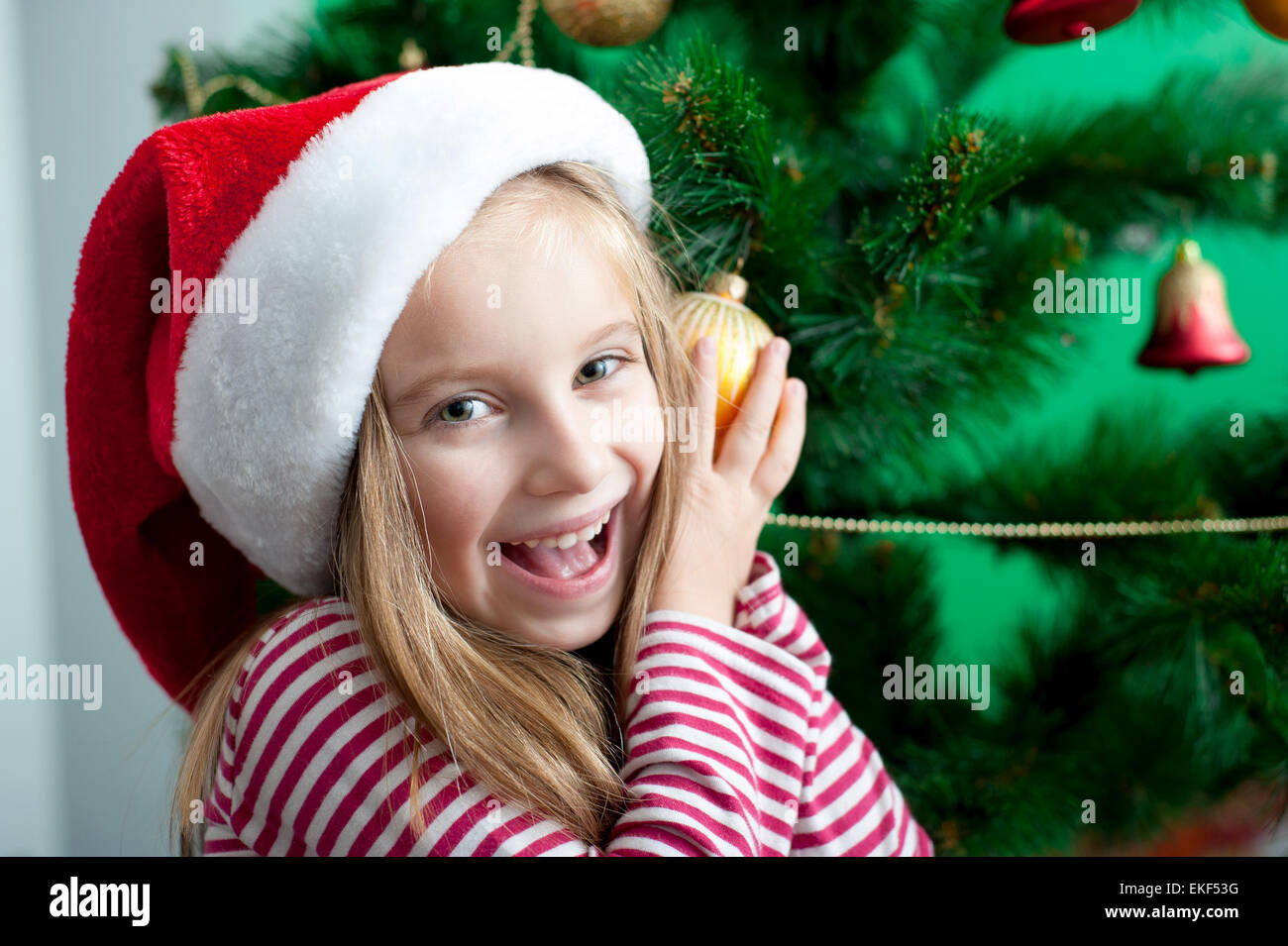 little girl with santa hat Stock Photo - Alamy