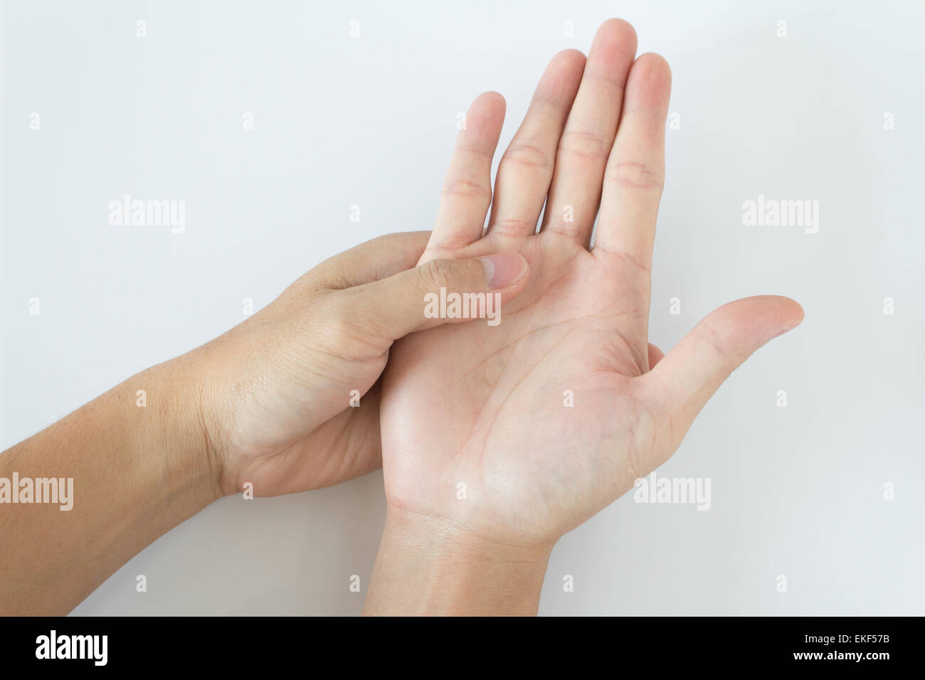 one man hand massaged other, isolated on white Stock Photo - Alamy
