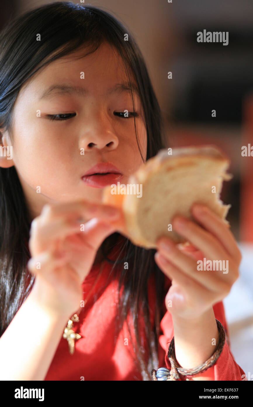 close up of hungry child eating bread Stock Photo - Alamy
