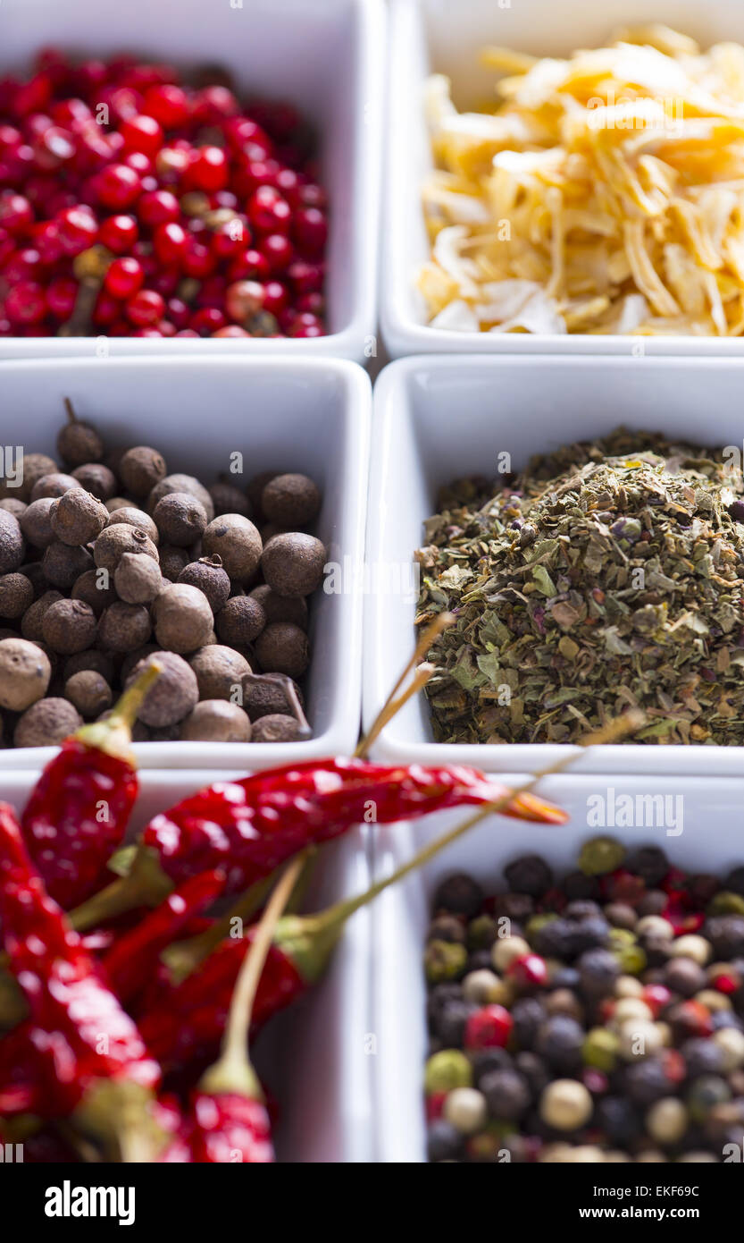 Assorted spices on wooden background Stock Photo - Alamy