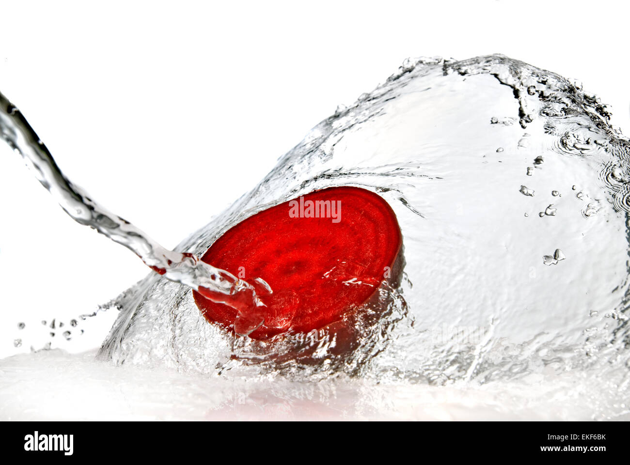 red beet with water splash isolated on white Stock Photo - Alamy