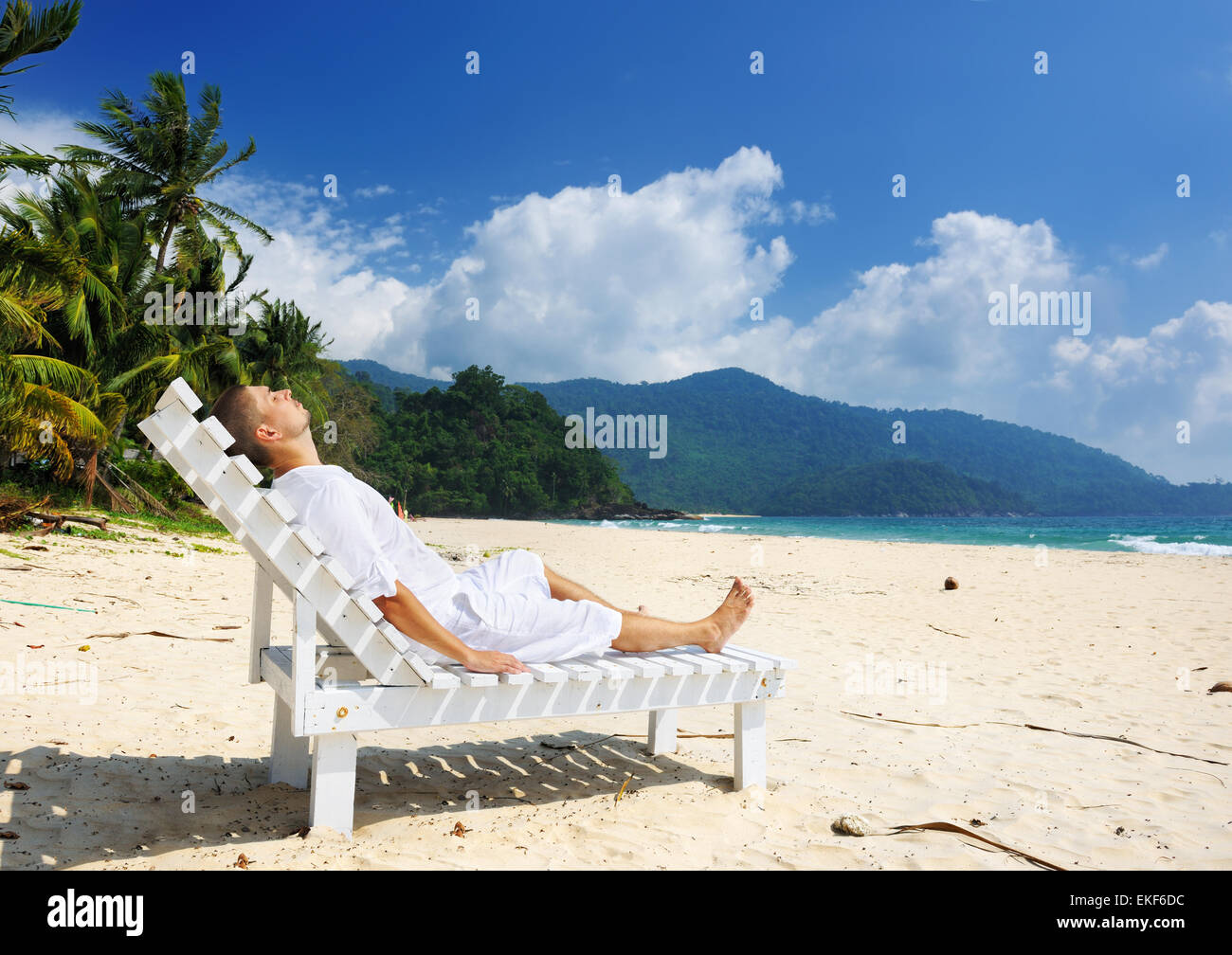 Man relaxing on a beach Stock Photo - Alamy