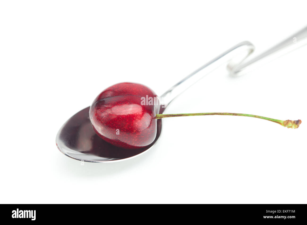 spoon and cherry isolated on white Stock Photo - Alamy