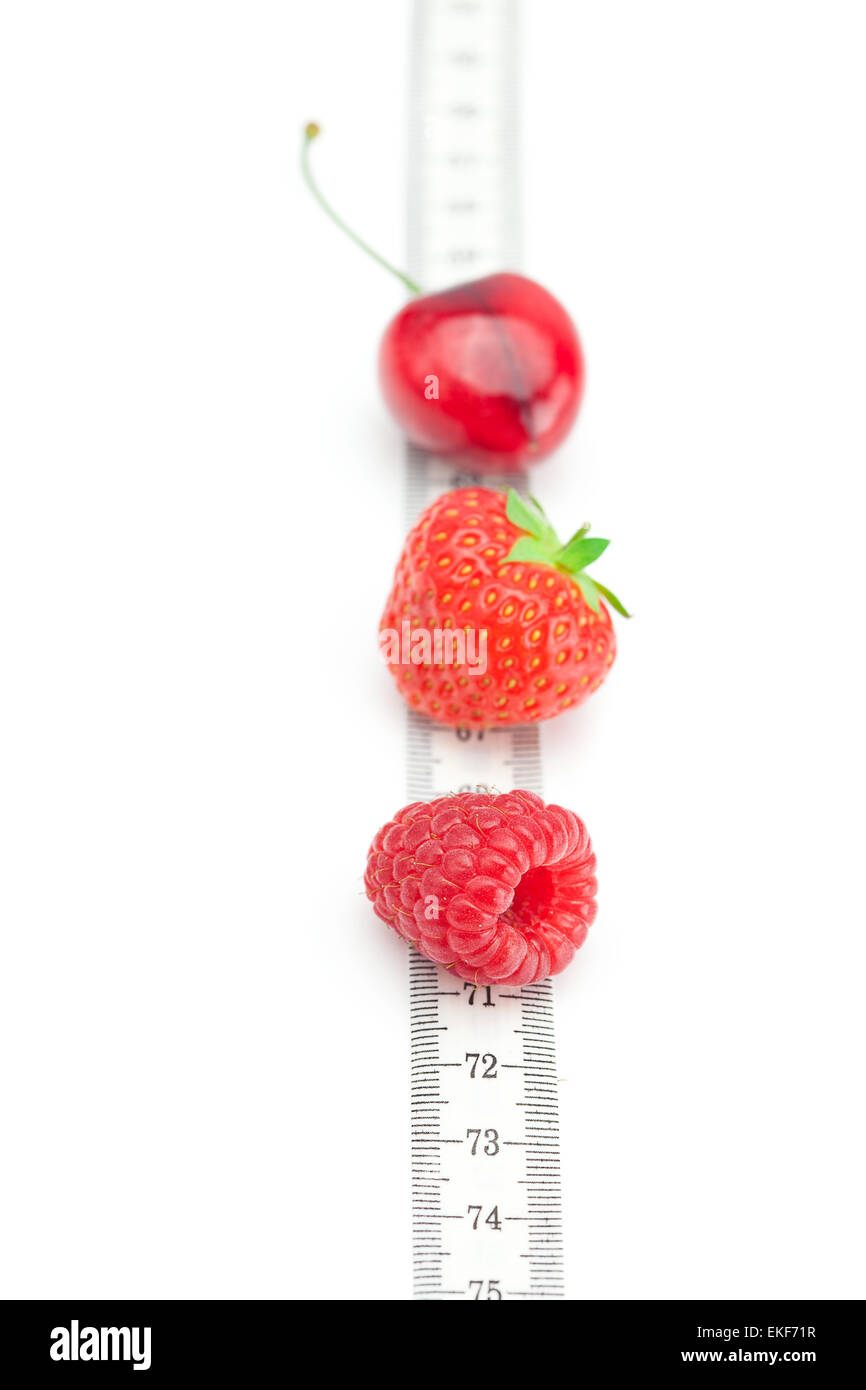 measure tape,cherry, raspberry and strawberries isolated on whit Stock ...
