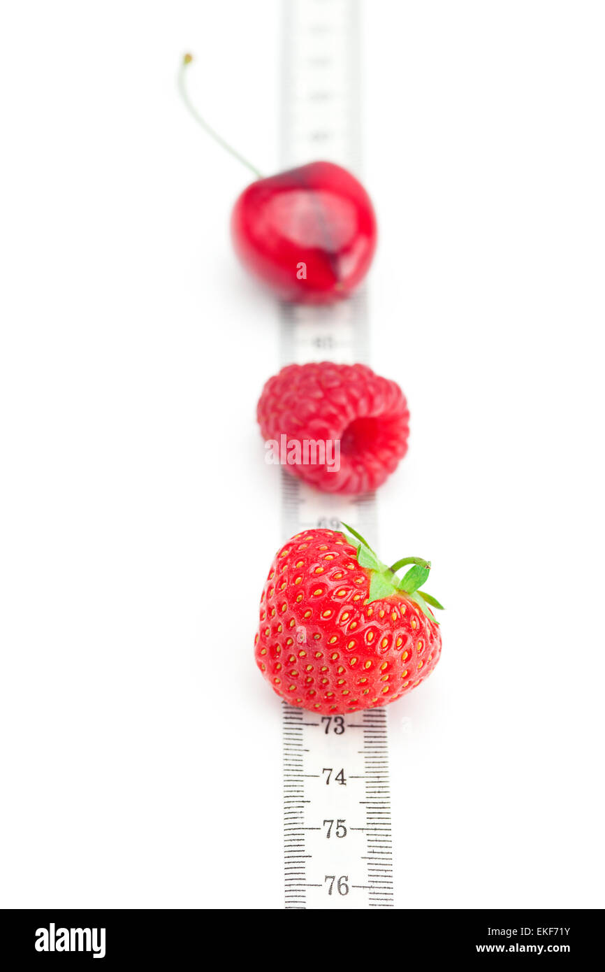 measure tape,cherry, raspberry and strawberries isolated on whit Stock ...