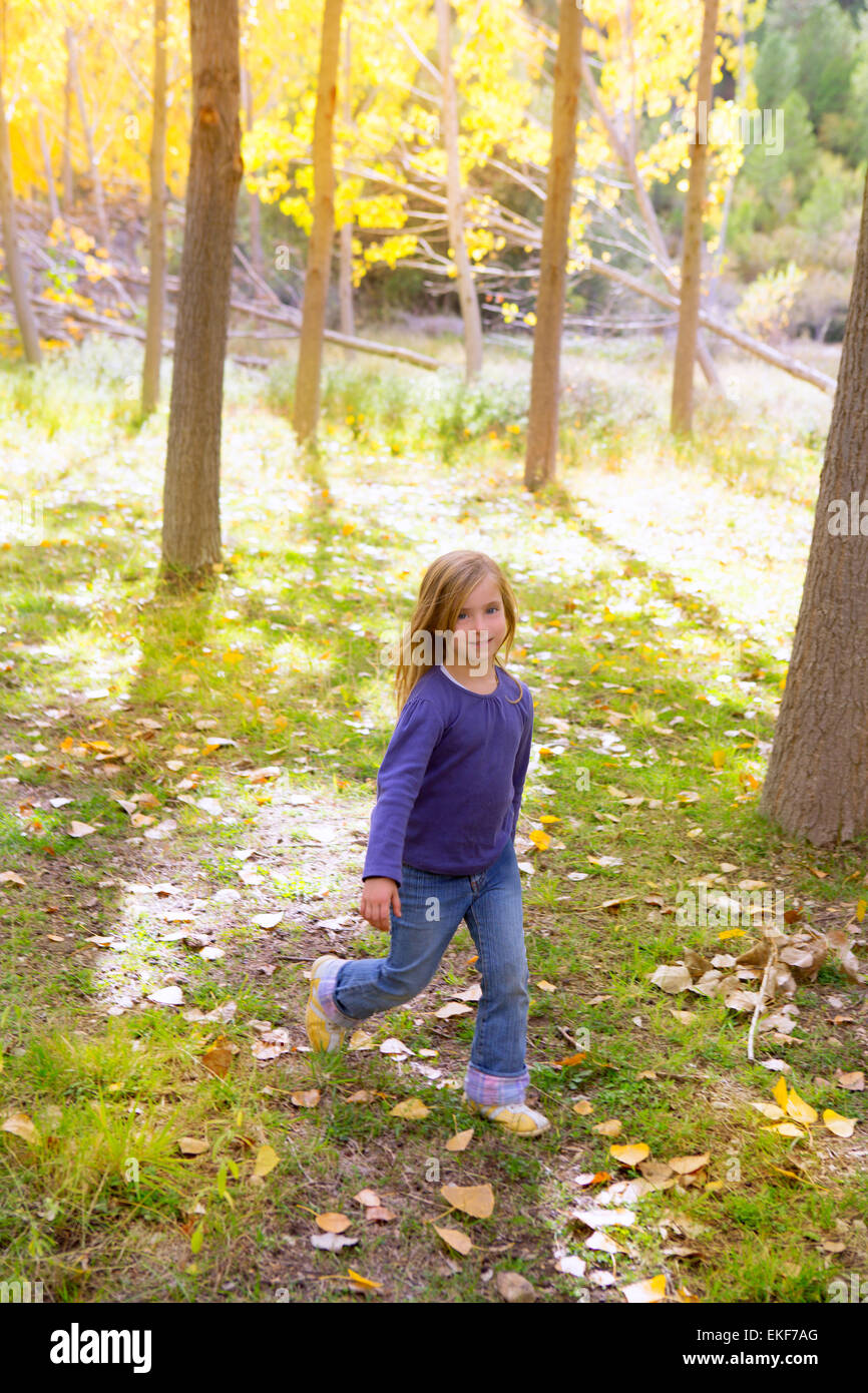 Autumn kid girl running poplar tree forest motion blur Stock Photo - Alamy
