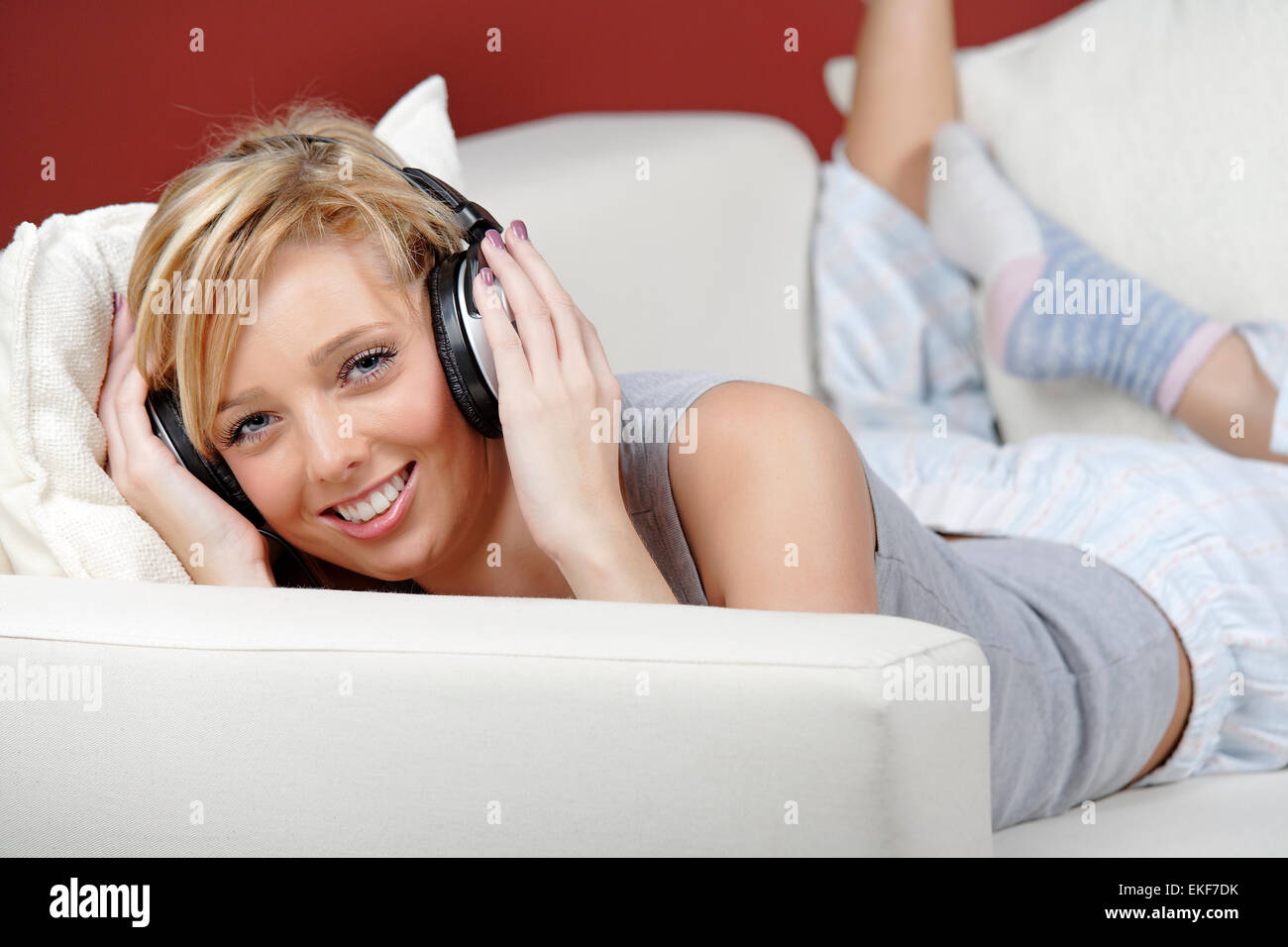 Woman listening to music Stock Photo - Alamy
