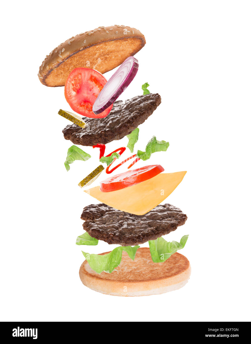 Delicious hamburger with flying ingredients on white background Stock ...