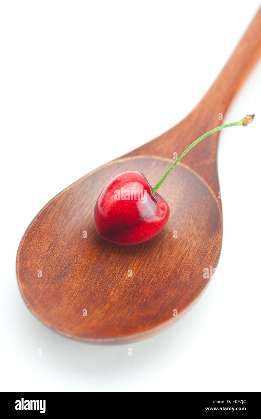 wooden spoon and cherry isolated on white Stock Photo - Alamy