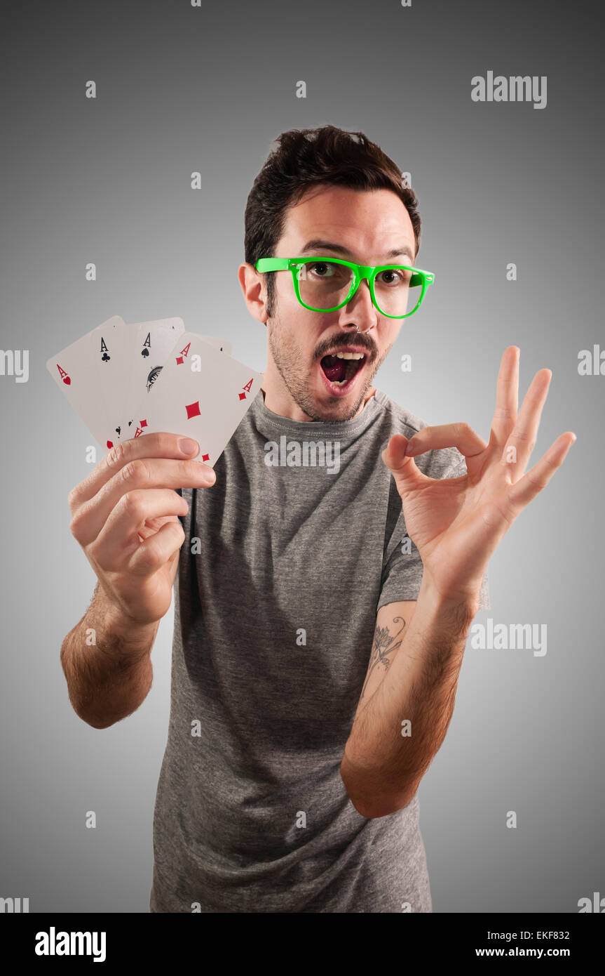 winner guy holding poker cards Stock Photo - Alamy