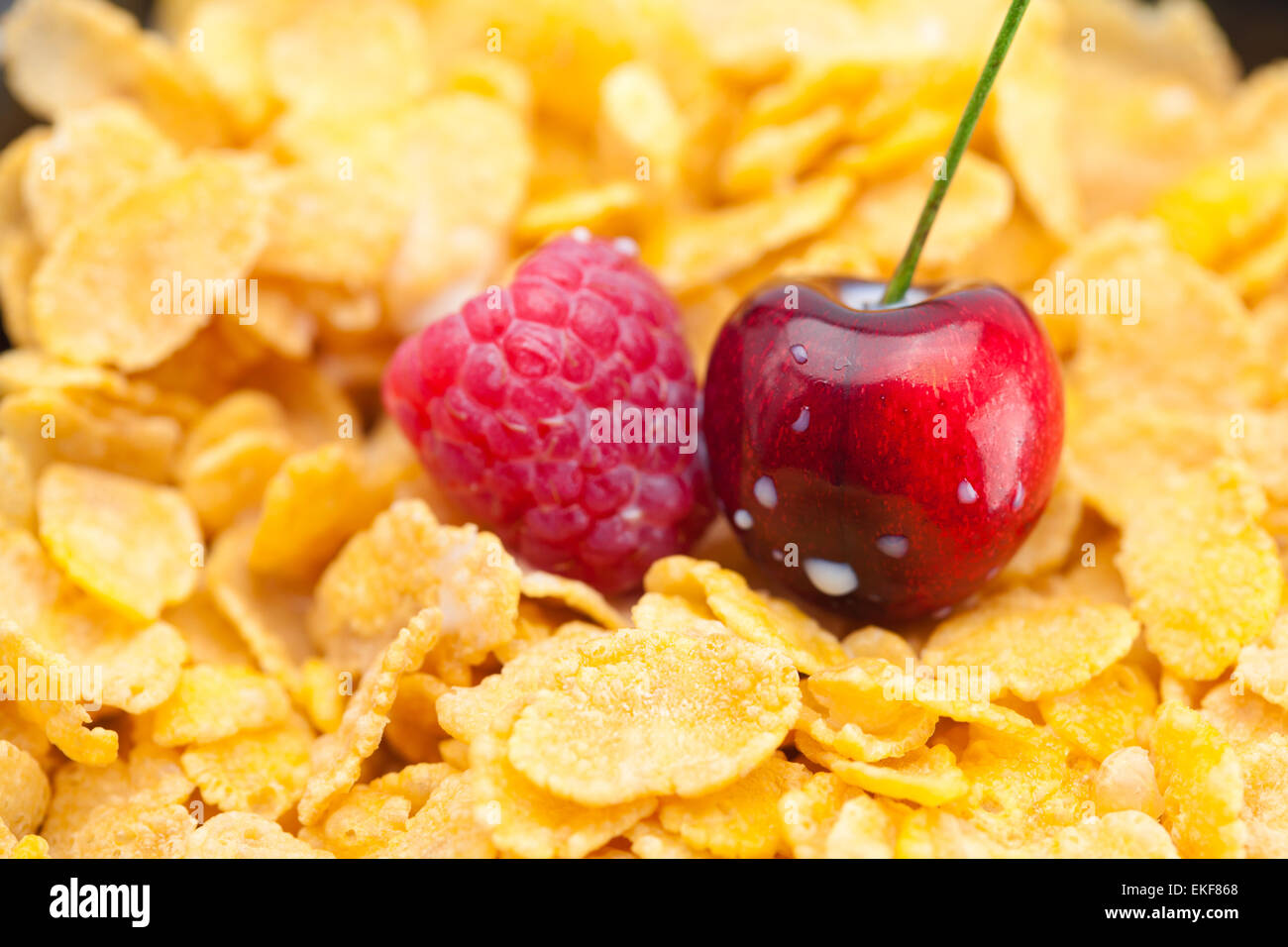 raspberry,cherry,milk and flakes in a bowl Stock Photo - Alamy