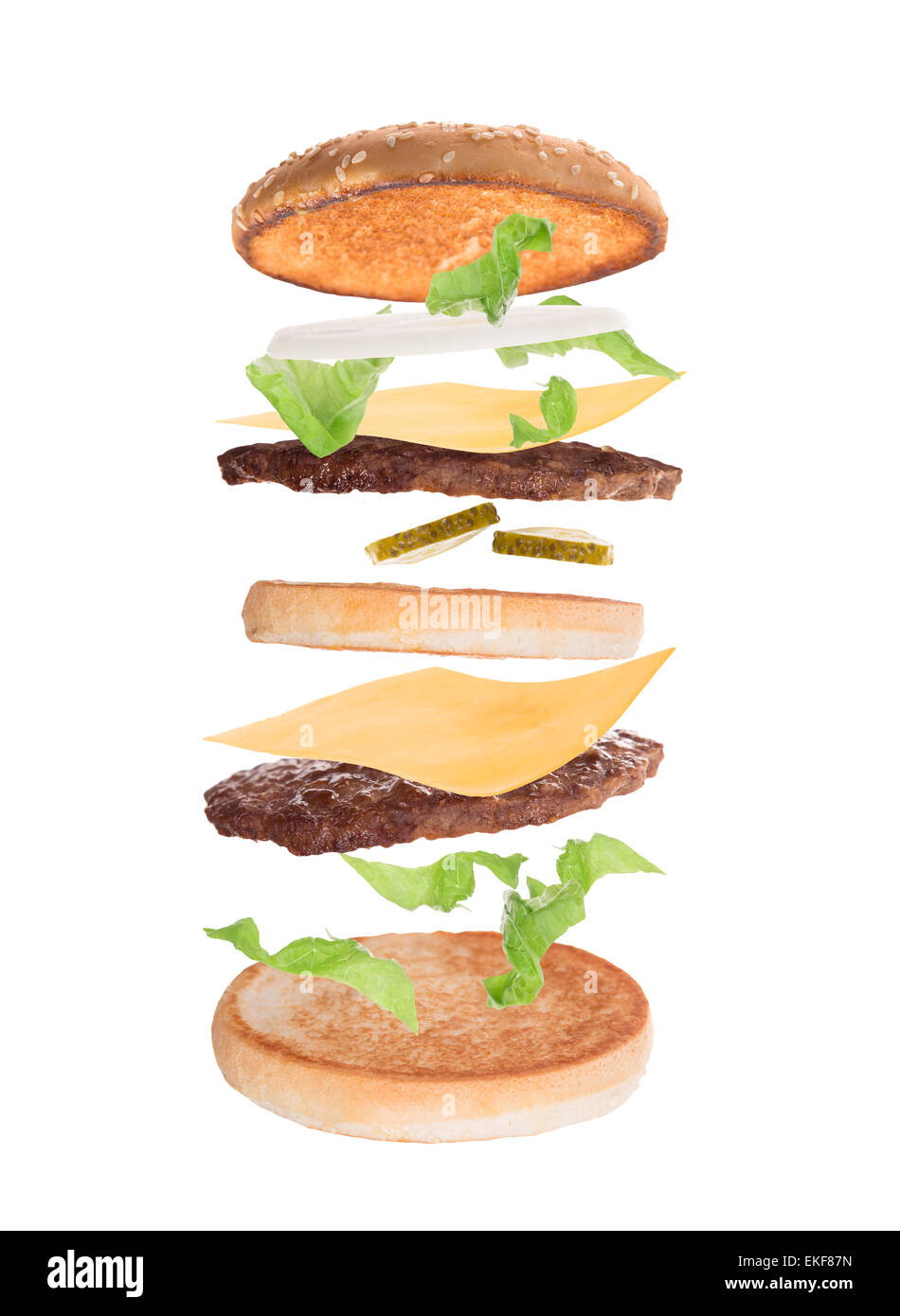 Delicious hamburger with flying ingredients on white background Stock ...