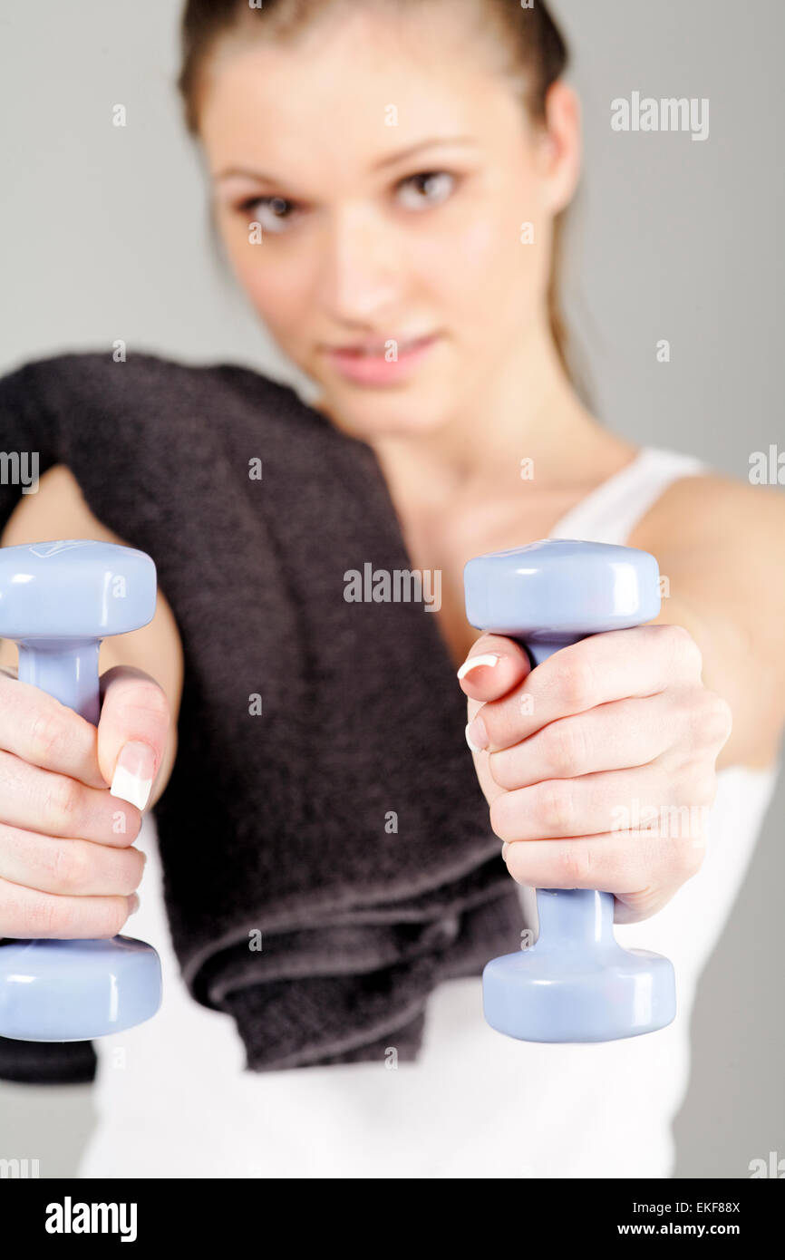 Woman working out with weights Stock Photo - Alamy