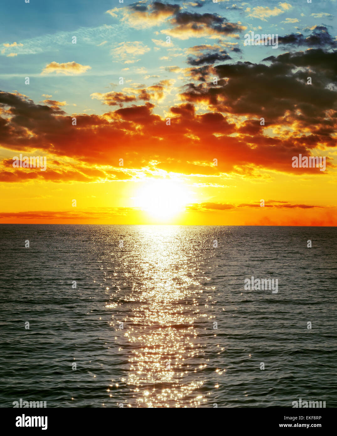 red sunset over water with waves Stock Photo - Alamy