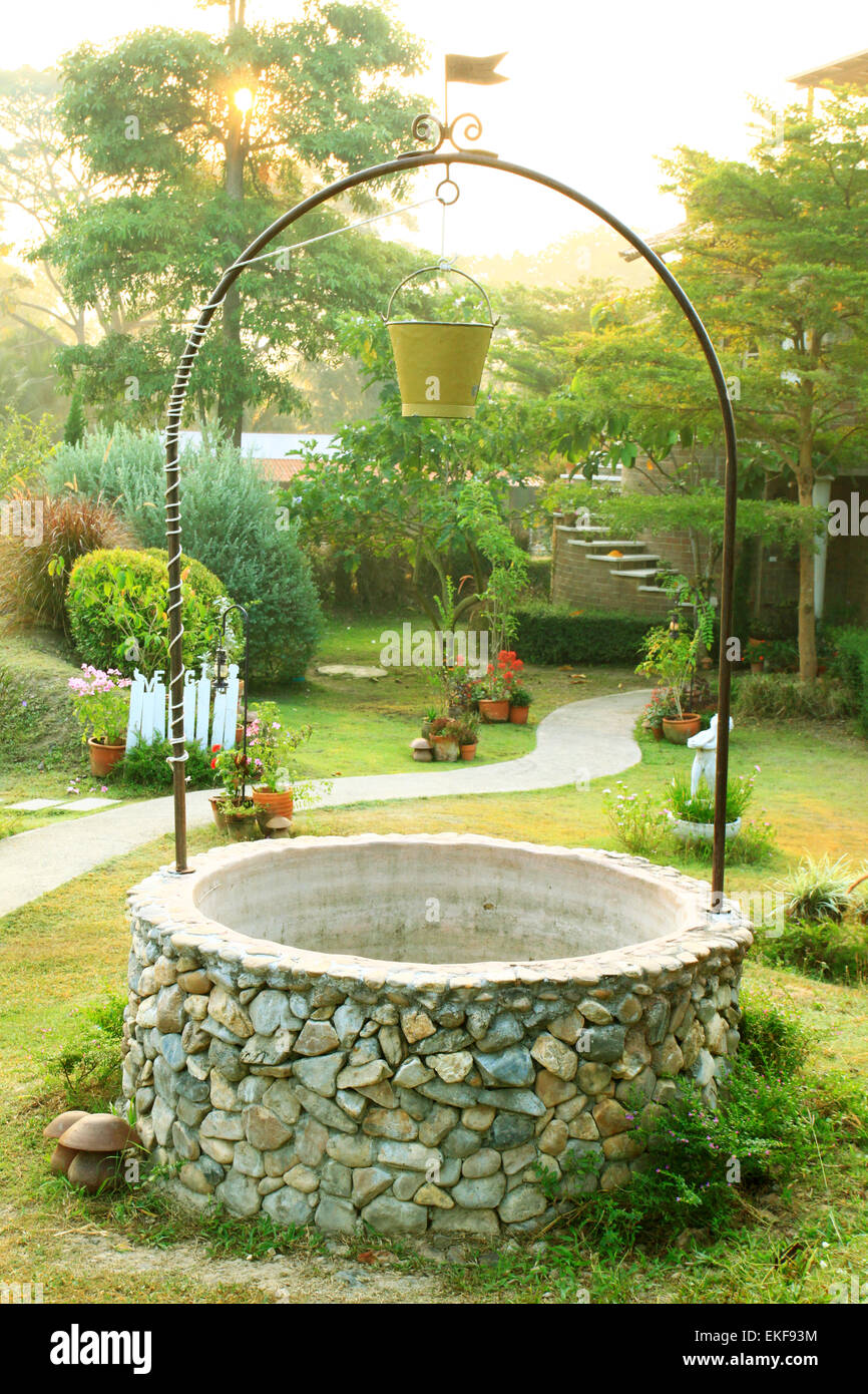 Old stone well with bucket hi-res stock photography and images - Alamy