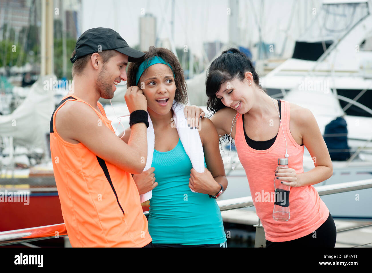 Group of young happy runners exercising early in the morning together ...