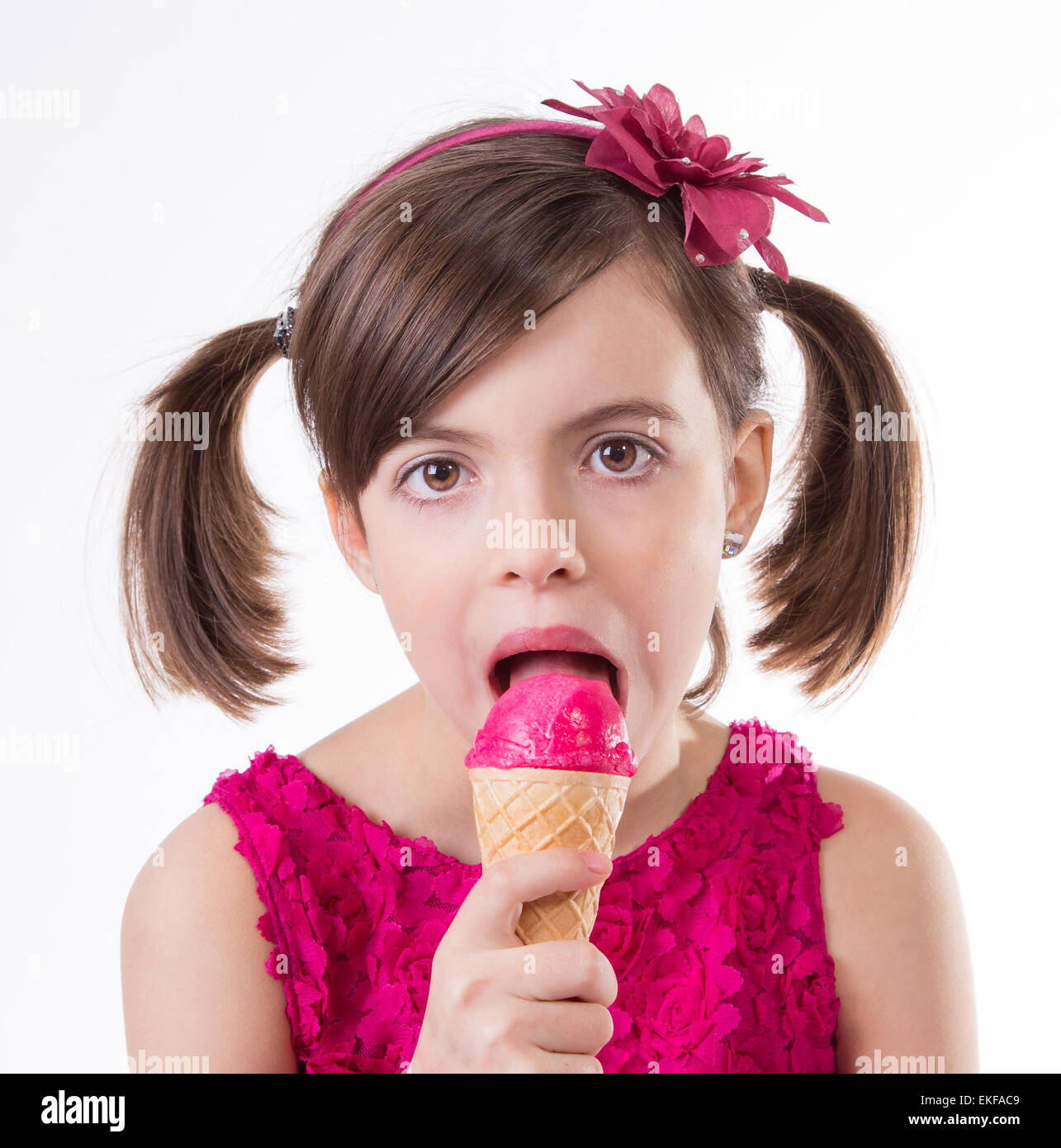 Little cute girl with ice cream over white background Stock Photo - Alamy