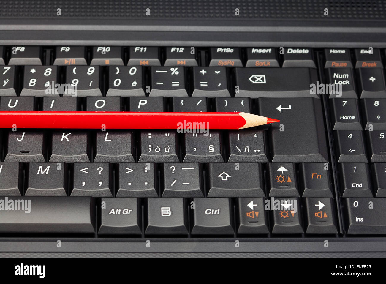 laptop keyboard and pencil Stock Photo - Alamy