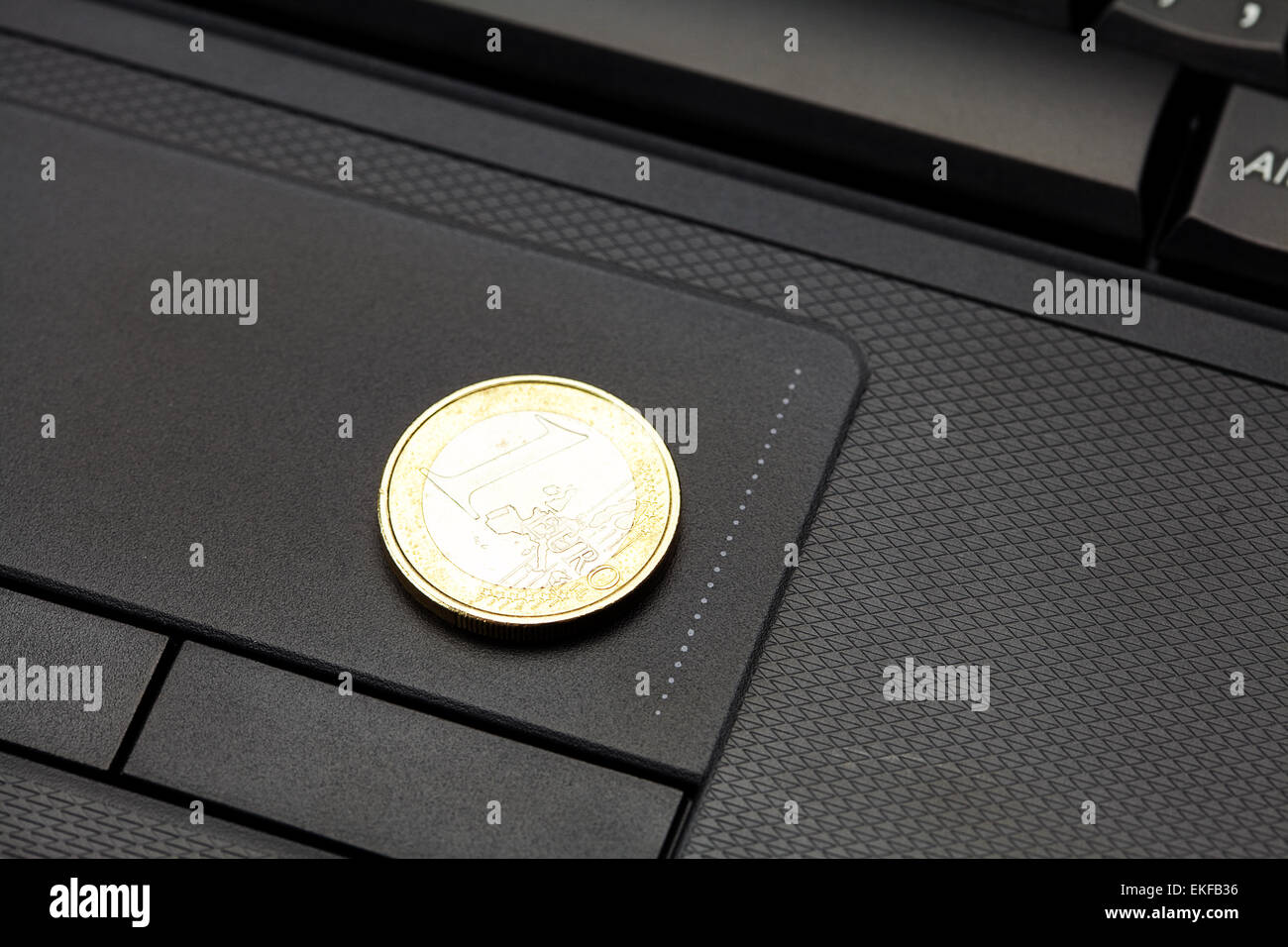 laptop keyboard and coin euro Stock Photo - Alamy