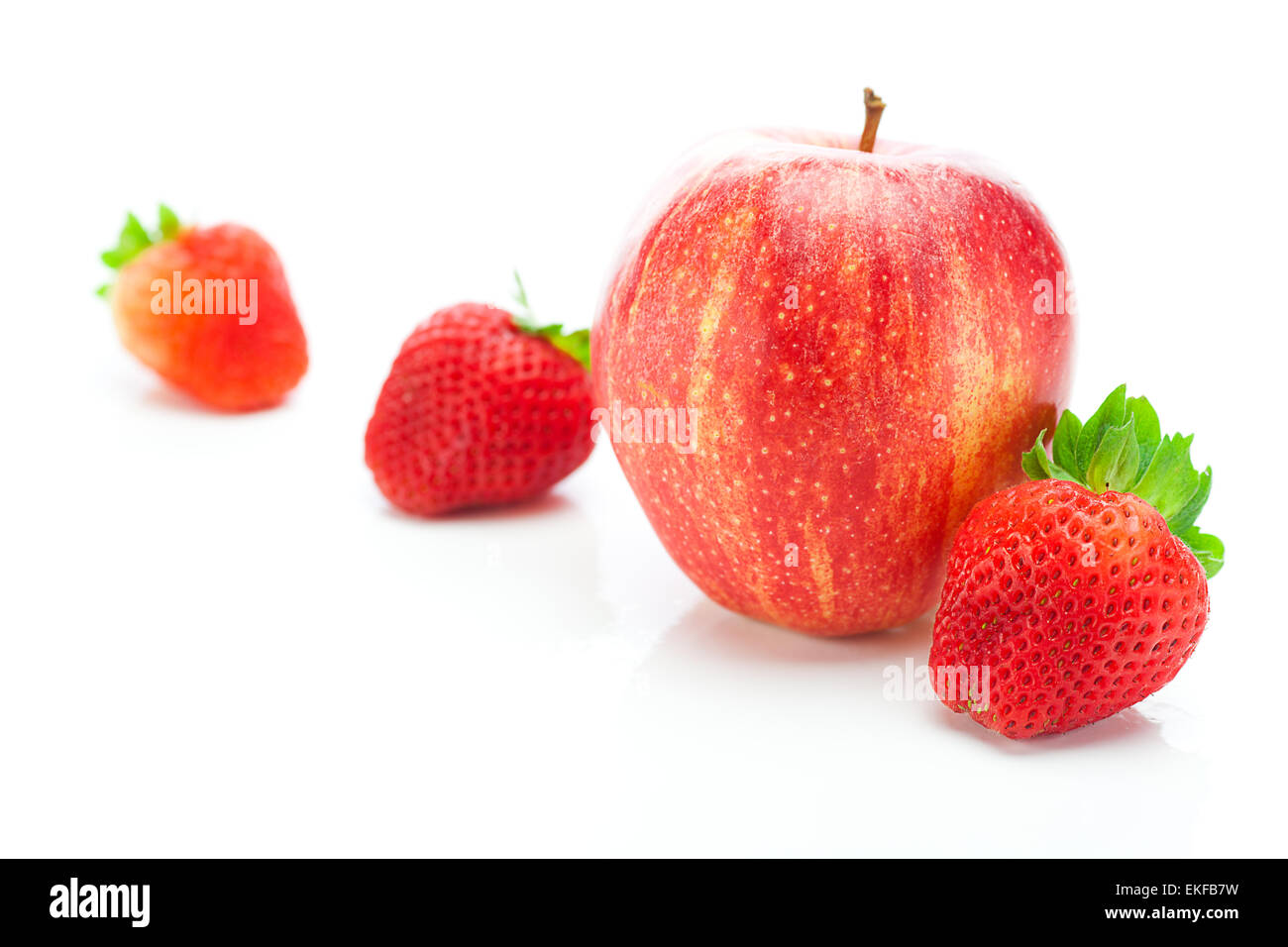 big juicy red ripe strawberries and apple isolated on white Stock Photo ...