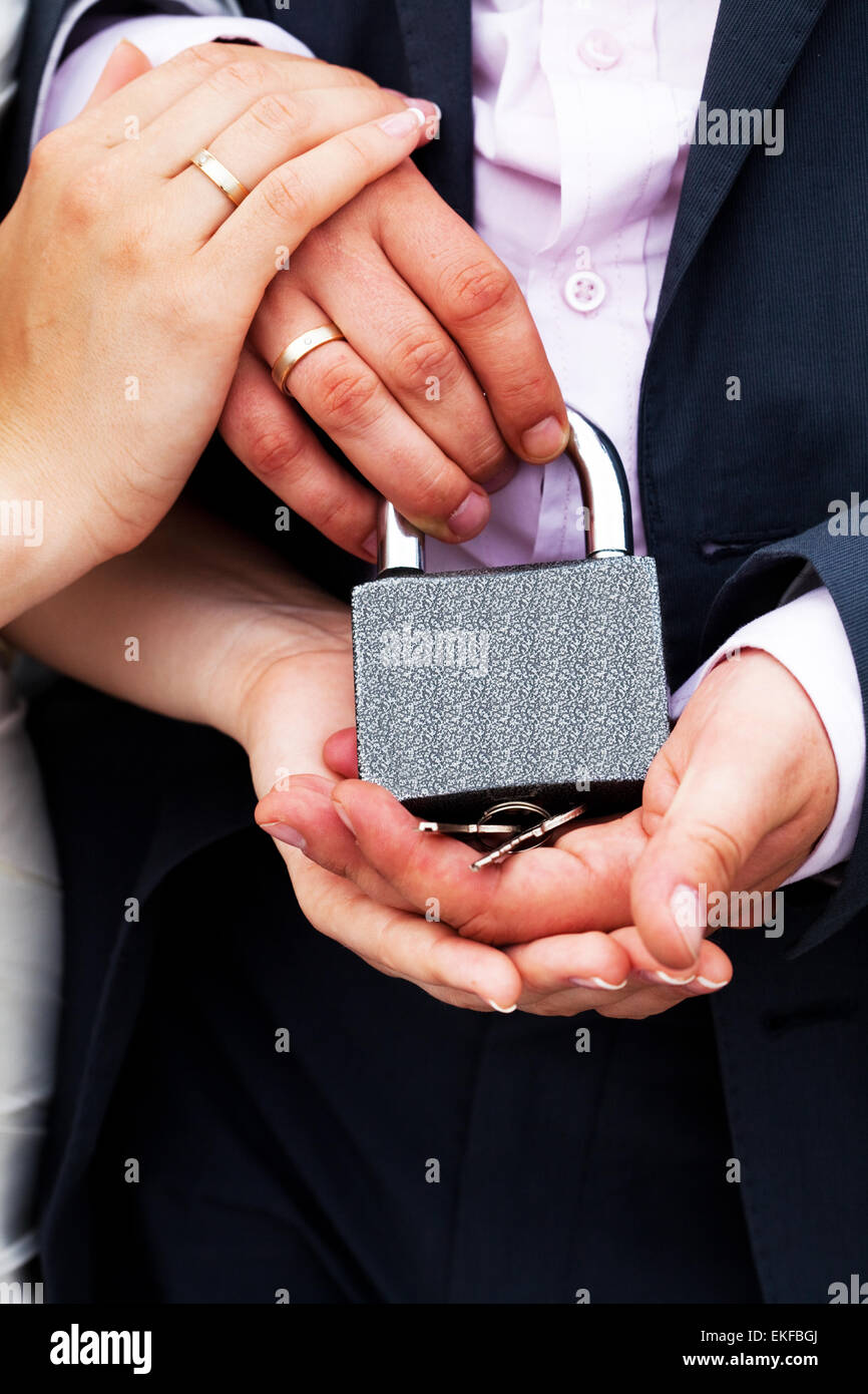 padlock with the chain in the hands of just married Stock Photo - Alamy