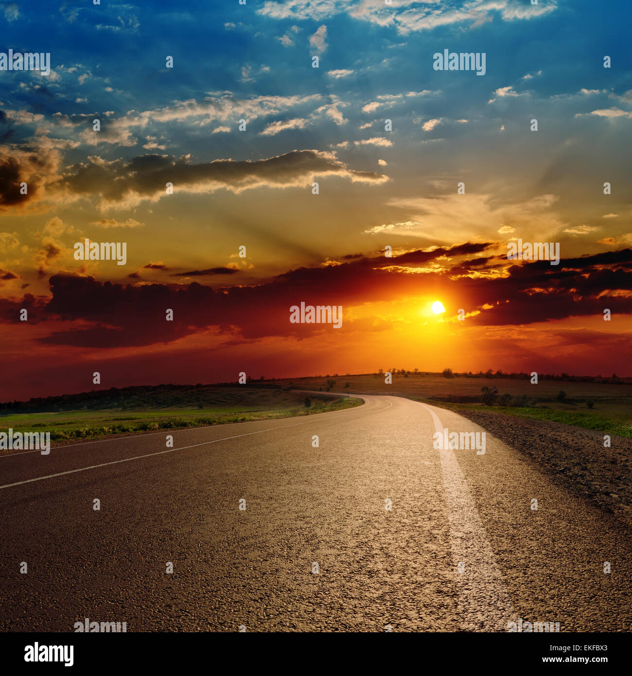 red dramatic sunset over asphalt road Stock Photo - Alamy