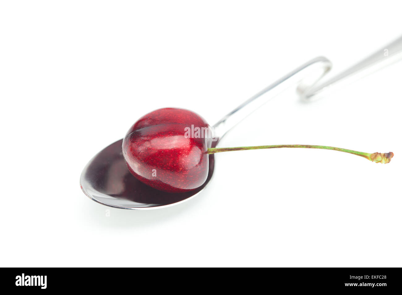 spoon and cherry isolated on white Stock Photo - Alamy