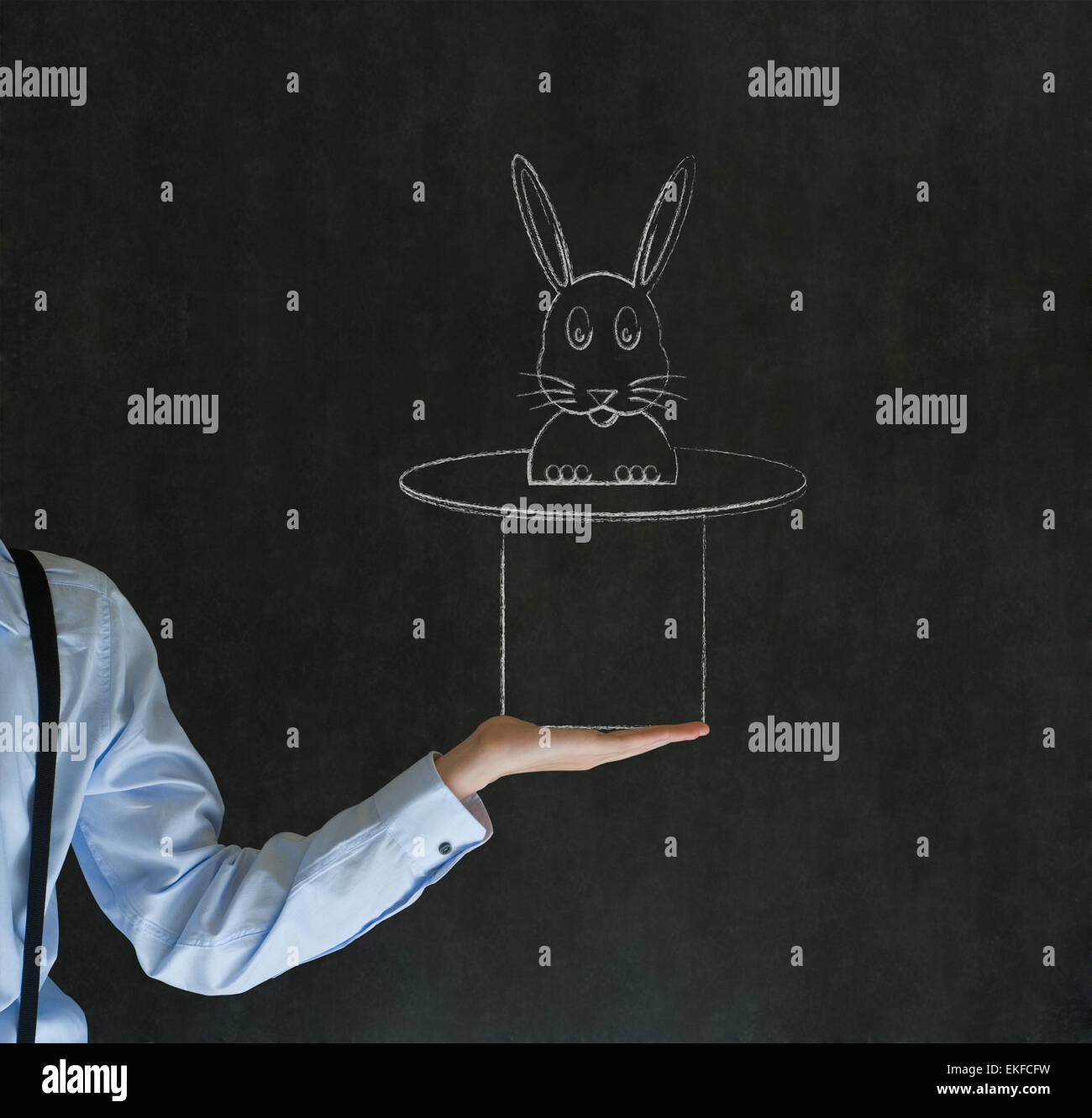 Man pulling rabbit from magic hat blackboard background Stock Photo - Alamy