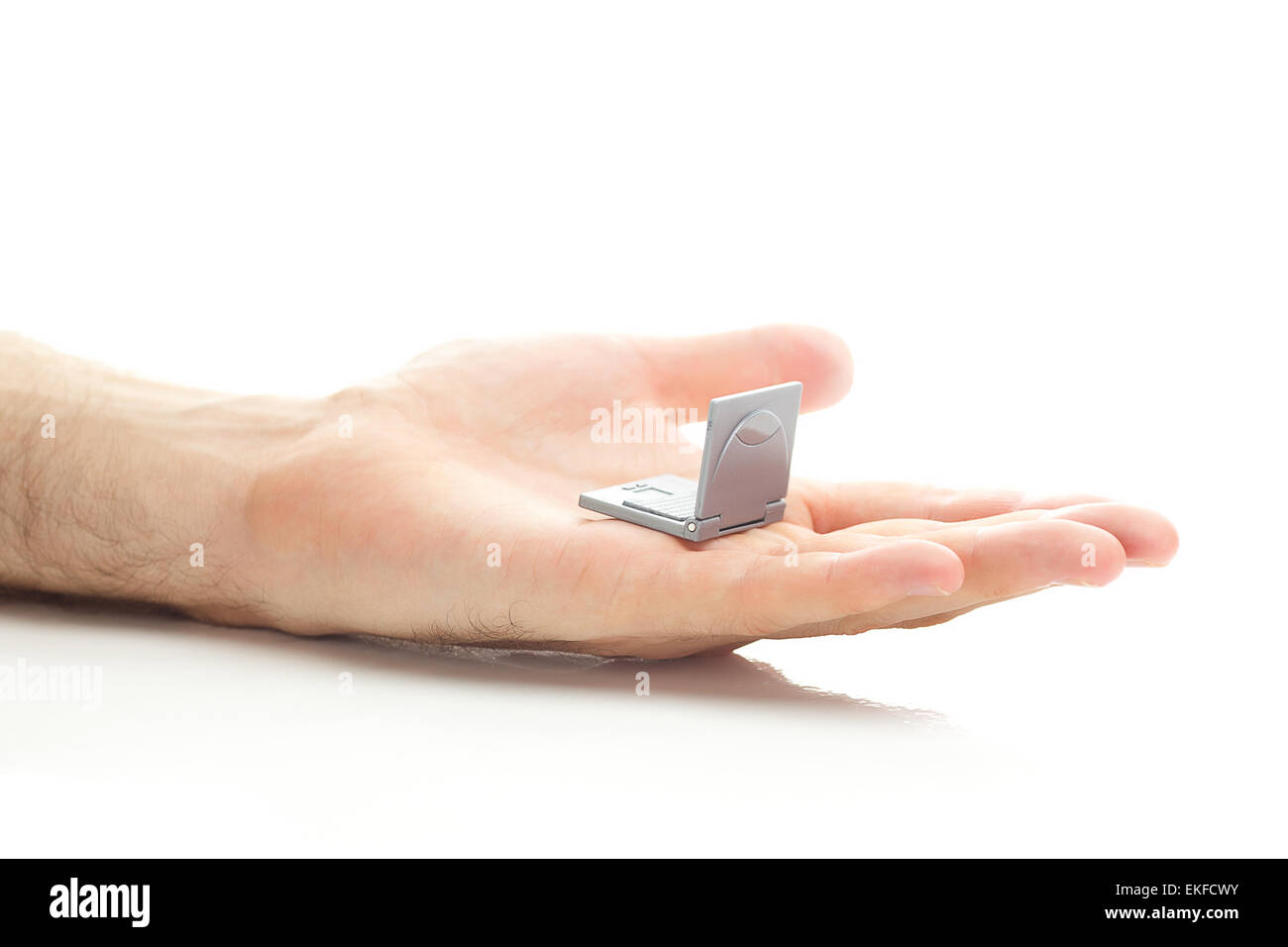 miniature laptop in hand isolated on white Stock Photo - Alamy