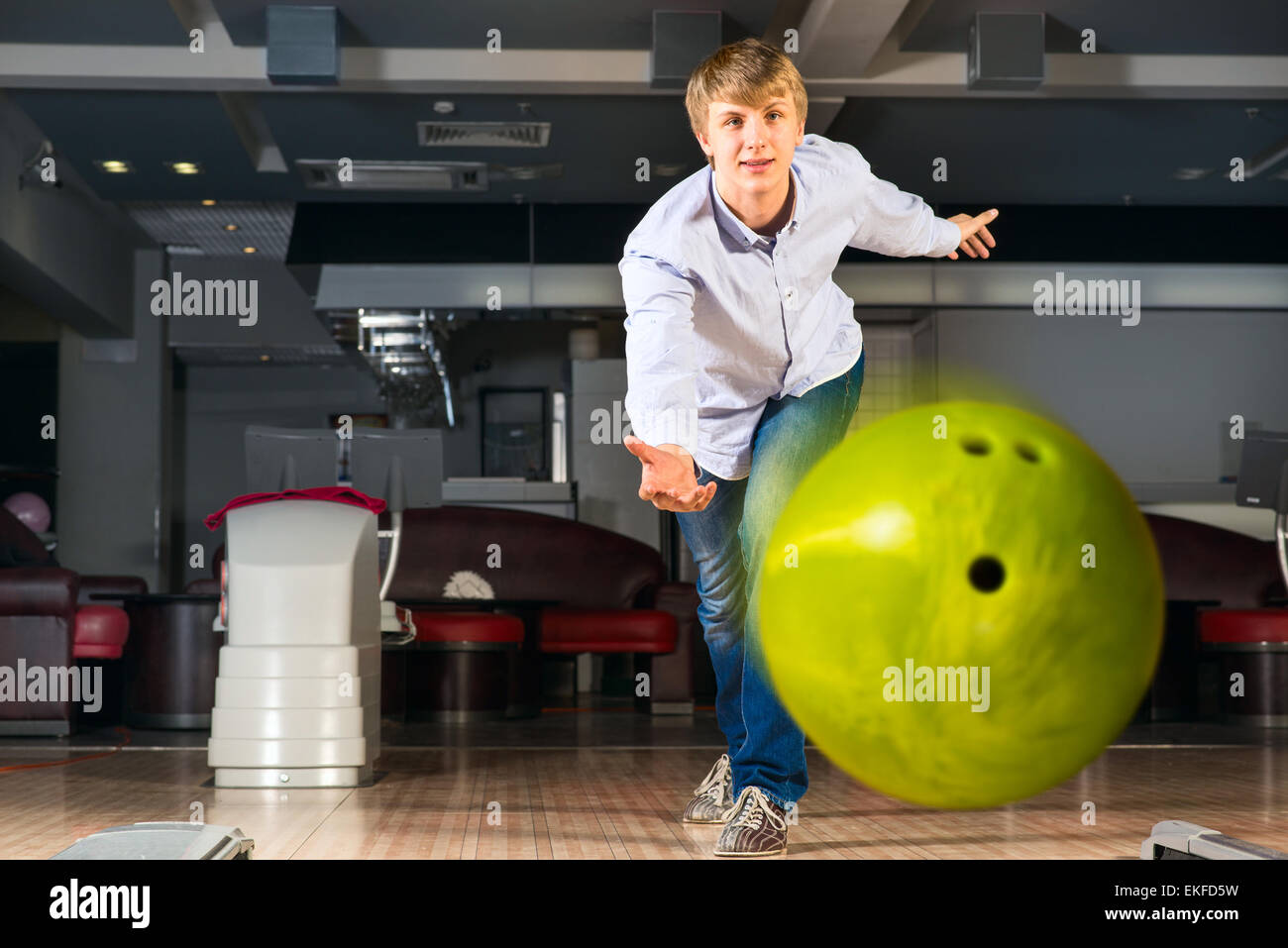 young man playing bowling Stock Photo - Alamy