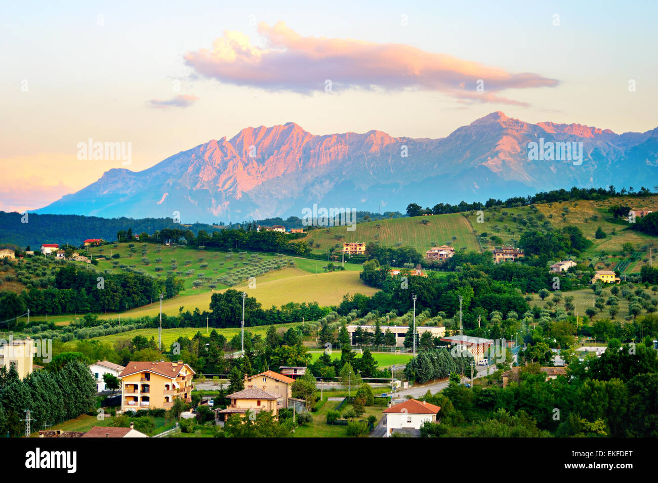 Landscape with village and mountains at sunset. Italy Stock Photo - Alamy
