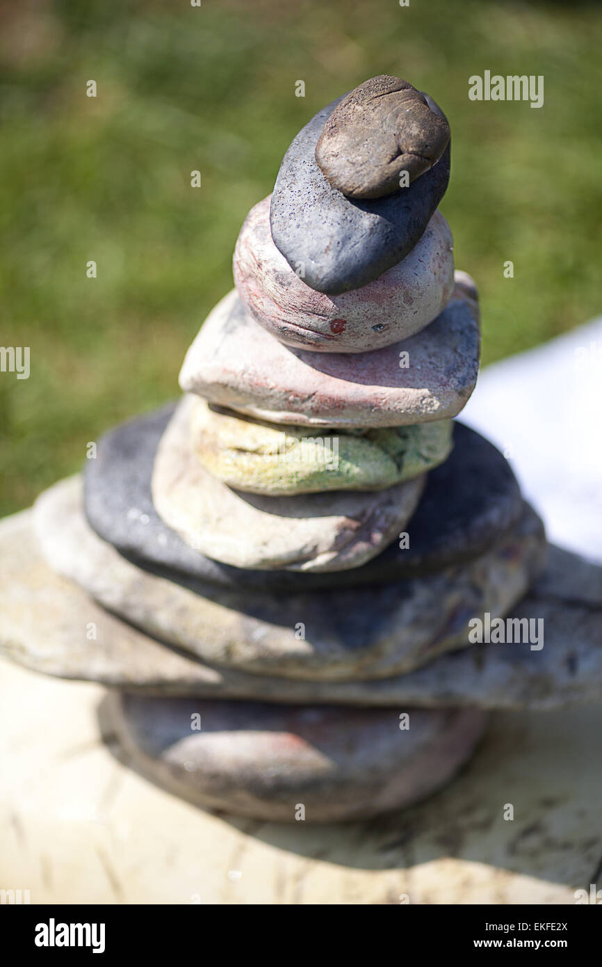 stones piled on each other against the background of grass Stock Photo ...